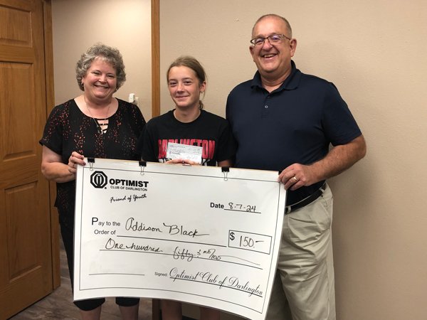 Optimist Band Trip Donation - Monroe Times